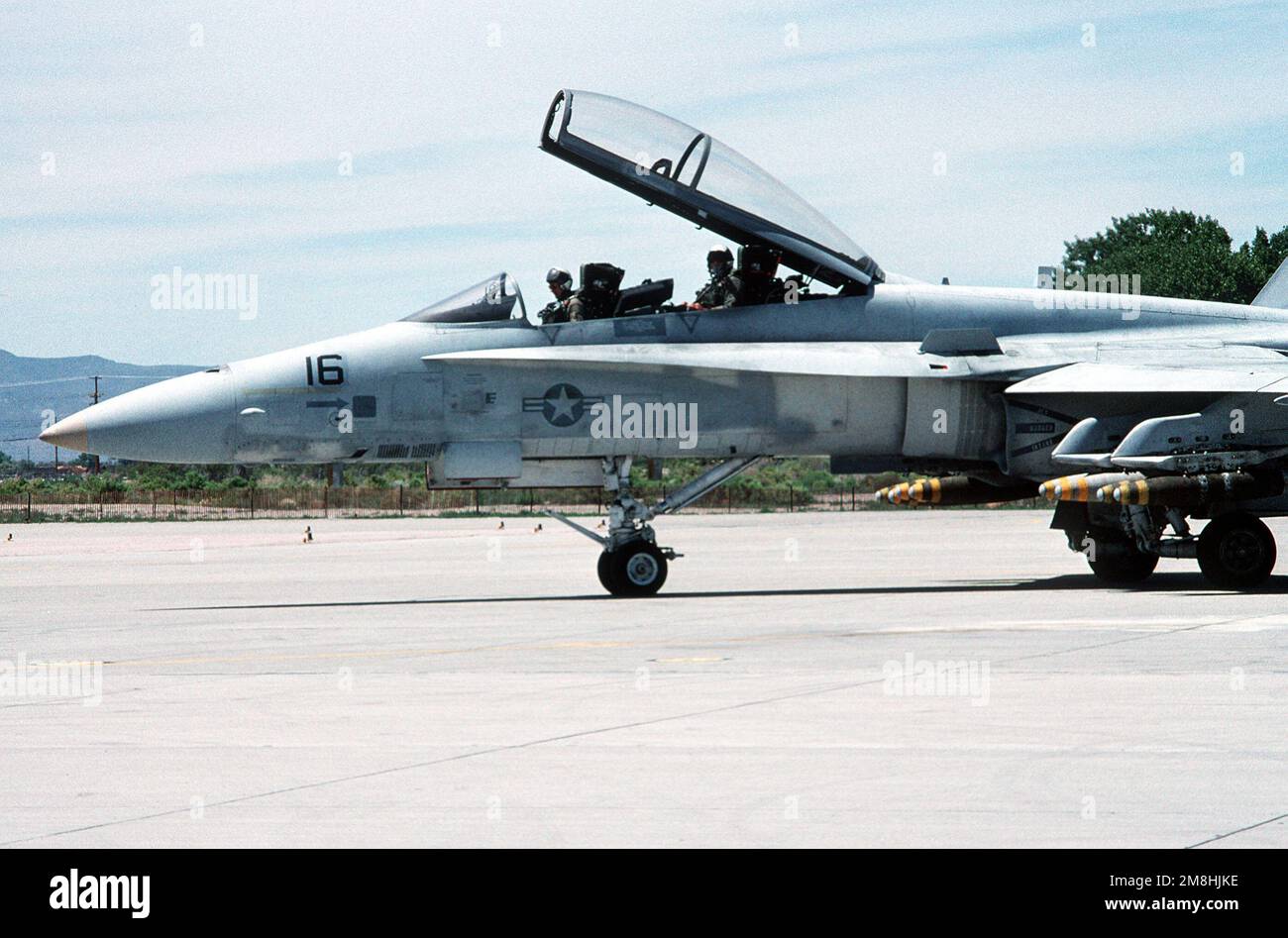 An F/A-18A Hornet aircraft of the Naval Strike Warfare School taxis out ...