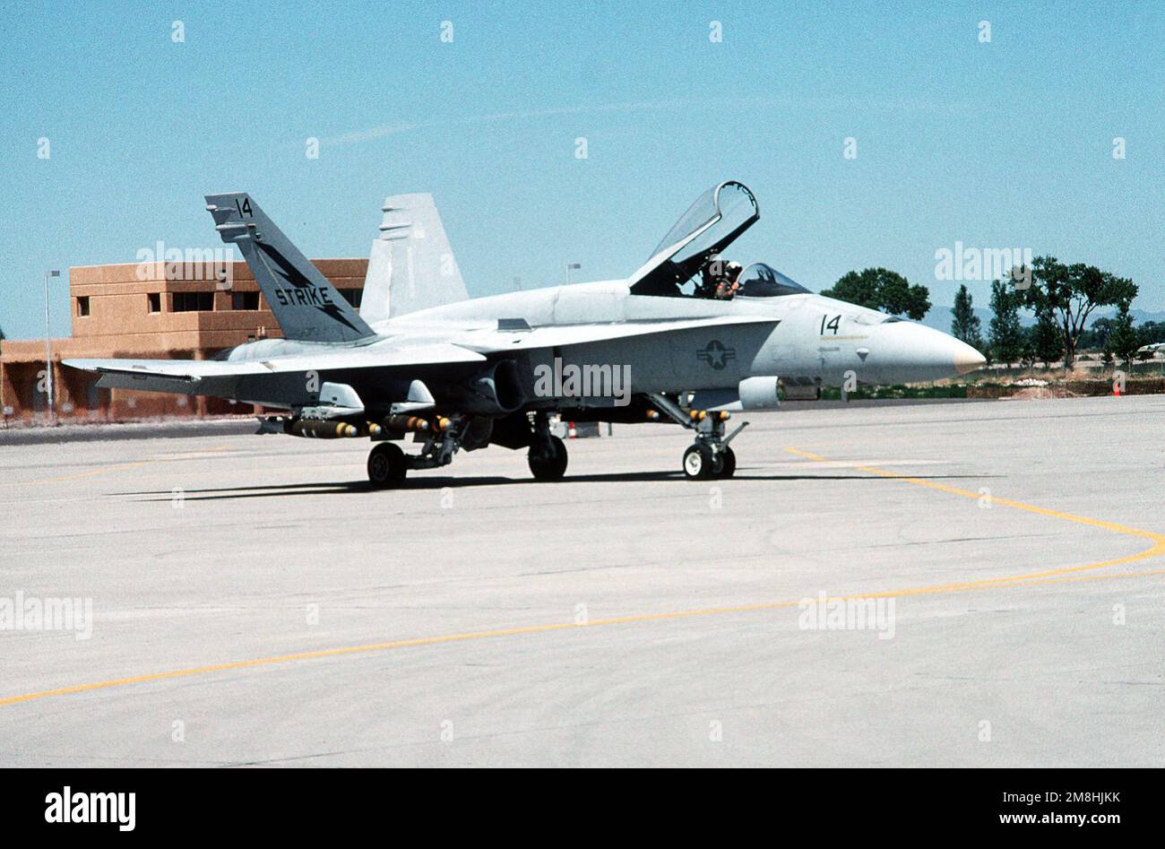 An F/A-18A Hornet aircraft of the Naval Strike Warfare School taxis out ...