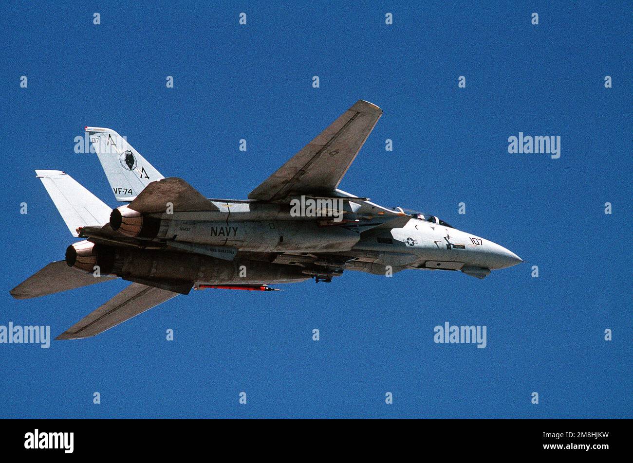 An underside view of a Fighter Squadron 74 (VF-74) F-14B Tomcat aircraft taxis to the runway ...