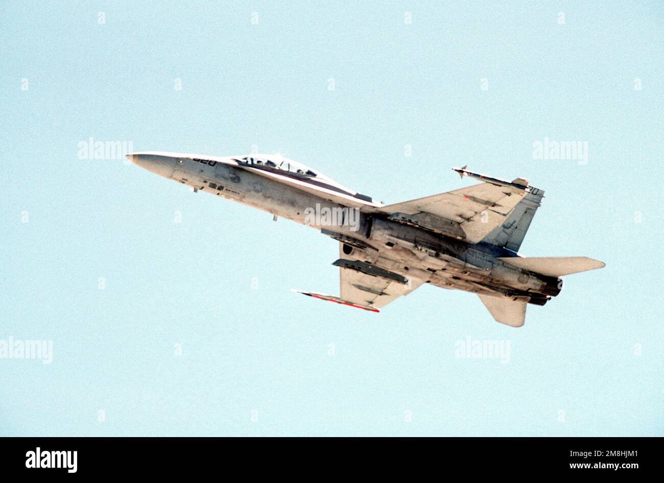 A Strike Fighter Squadron 125 (VFA-125) F/A-18D Hornet aircraft flies ...