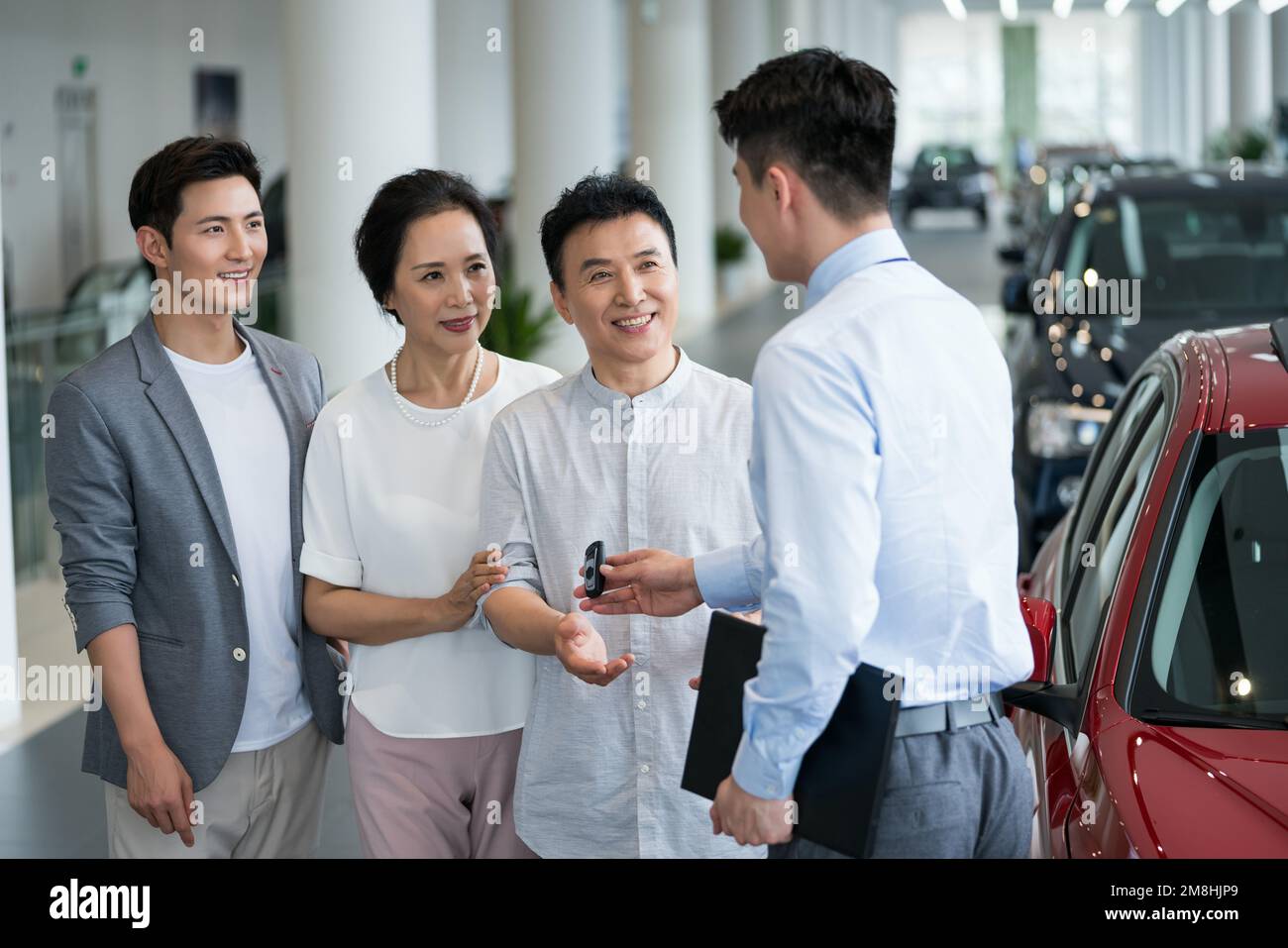 Three of choose and buy cars Stock Photo - Alamy