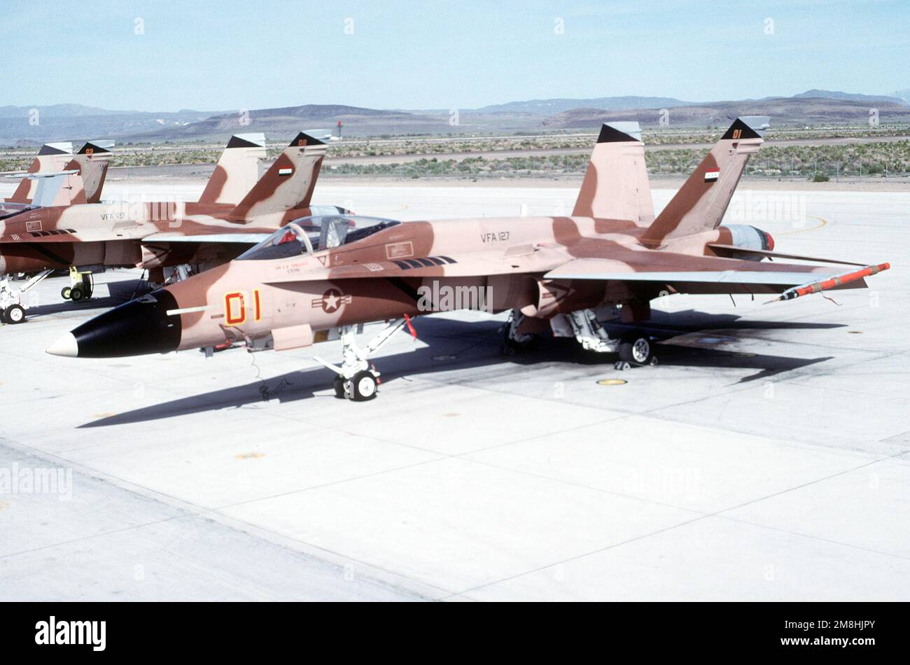 A Strike Fighter Squadron 127 (VFA-127) F/A-18A Hornet aircraft stands ...