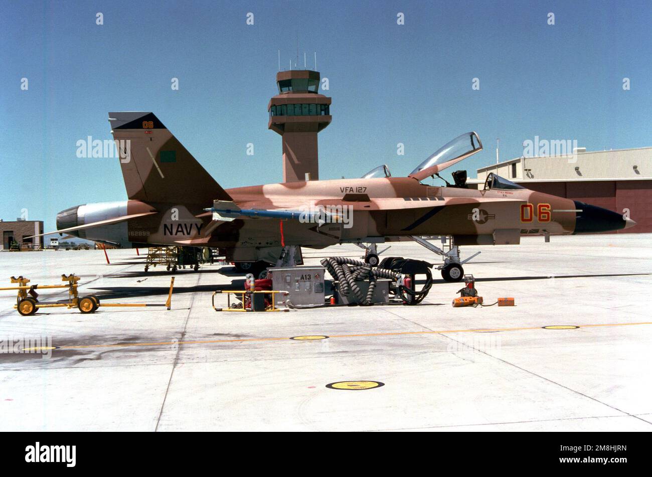 Servicing equipment is positioned beside a Strike Fighter Squadron 127 ...
