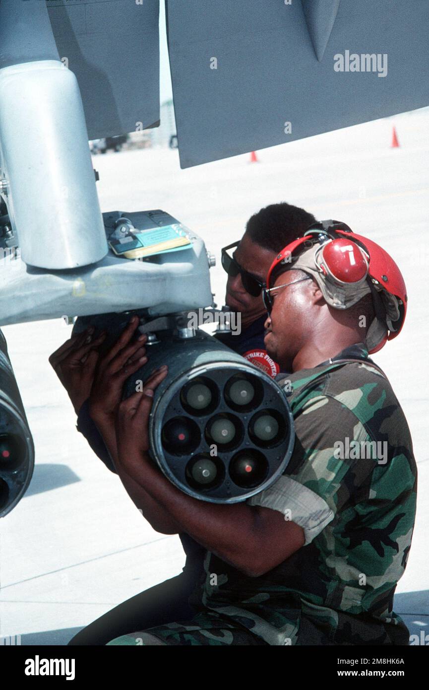 GUNNERY SGT. Kenneth C. Eaton and CPL. Eric D. Bell attack an LAU-68 2. ...