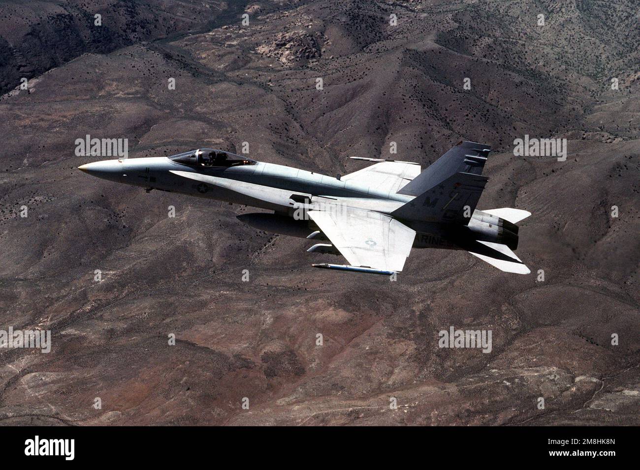 An air-to-air left side view of a Marine Fighter Attack Squadron 321 ...