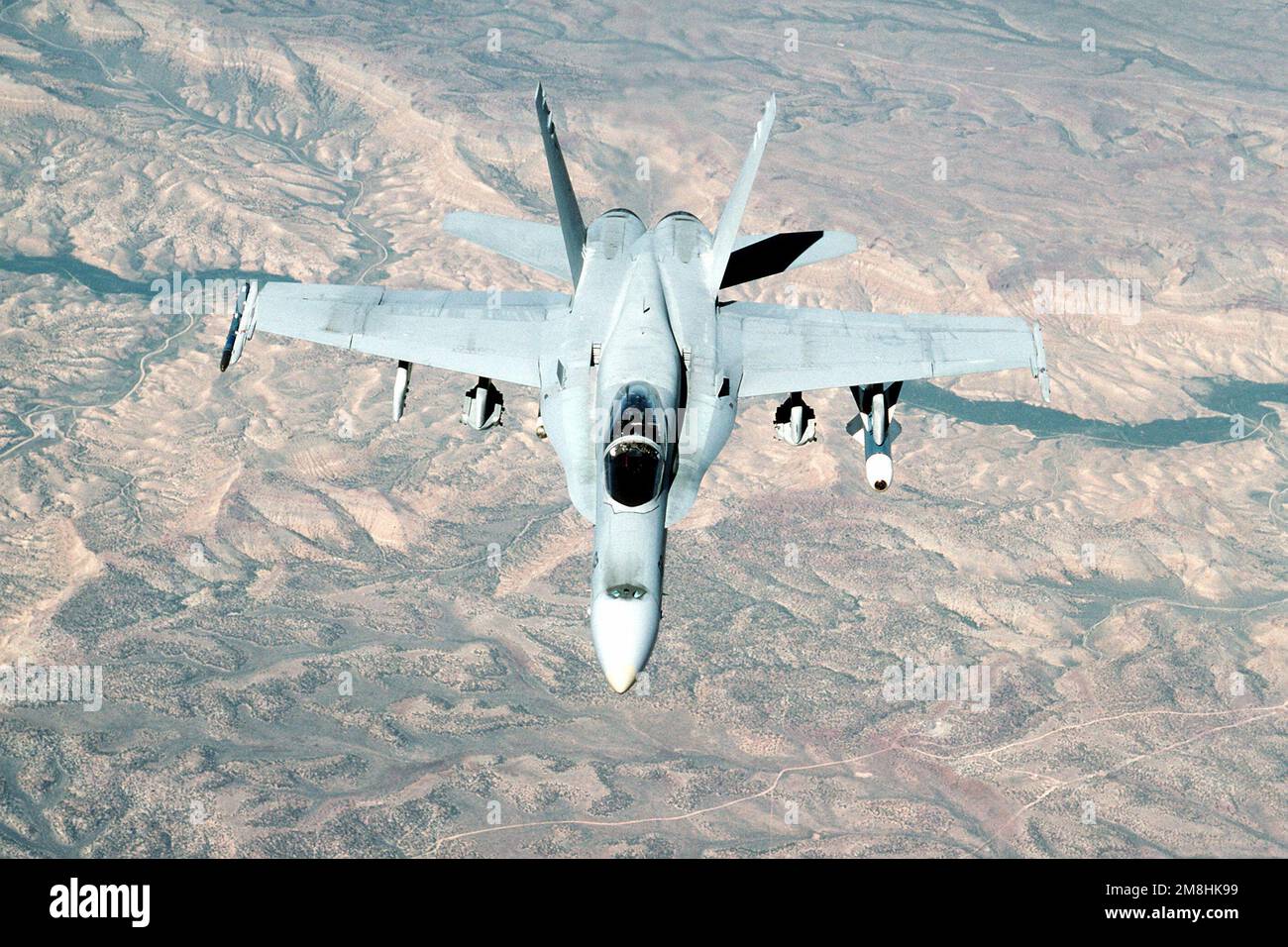 An air-to-air front view of a Marine Fighter Attack Squadron 321 (VMFA ...