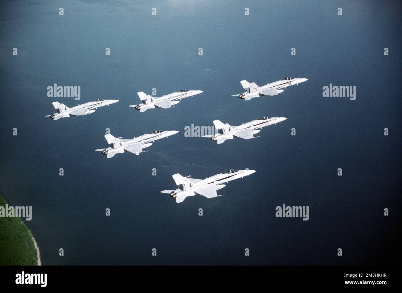 An air-to-air right side view of six Strike Fighter Squadron 136 (VFA ...