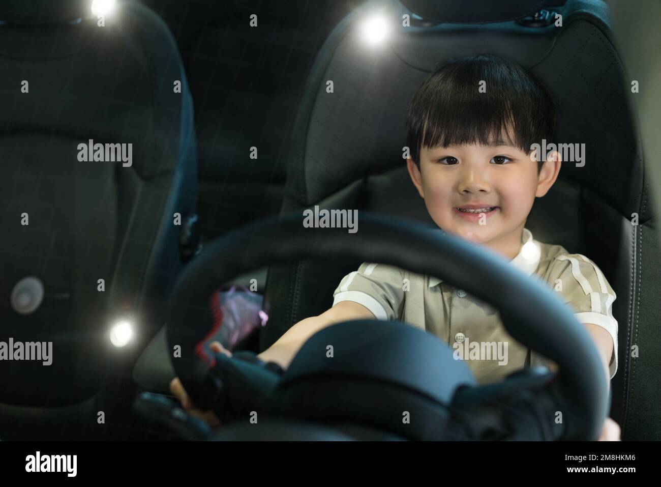 The little boy when the driver experience Stock Photo - Alamy