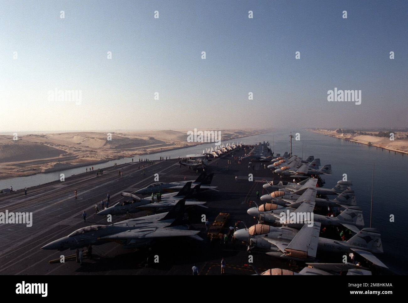 Various aircraft line the flight deck of the nuclear-powered aircraft ...