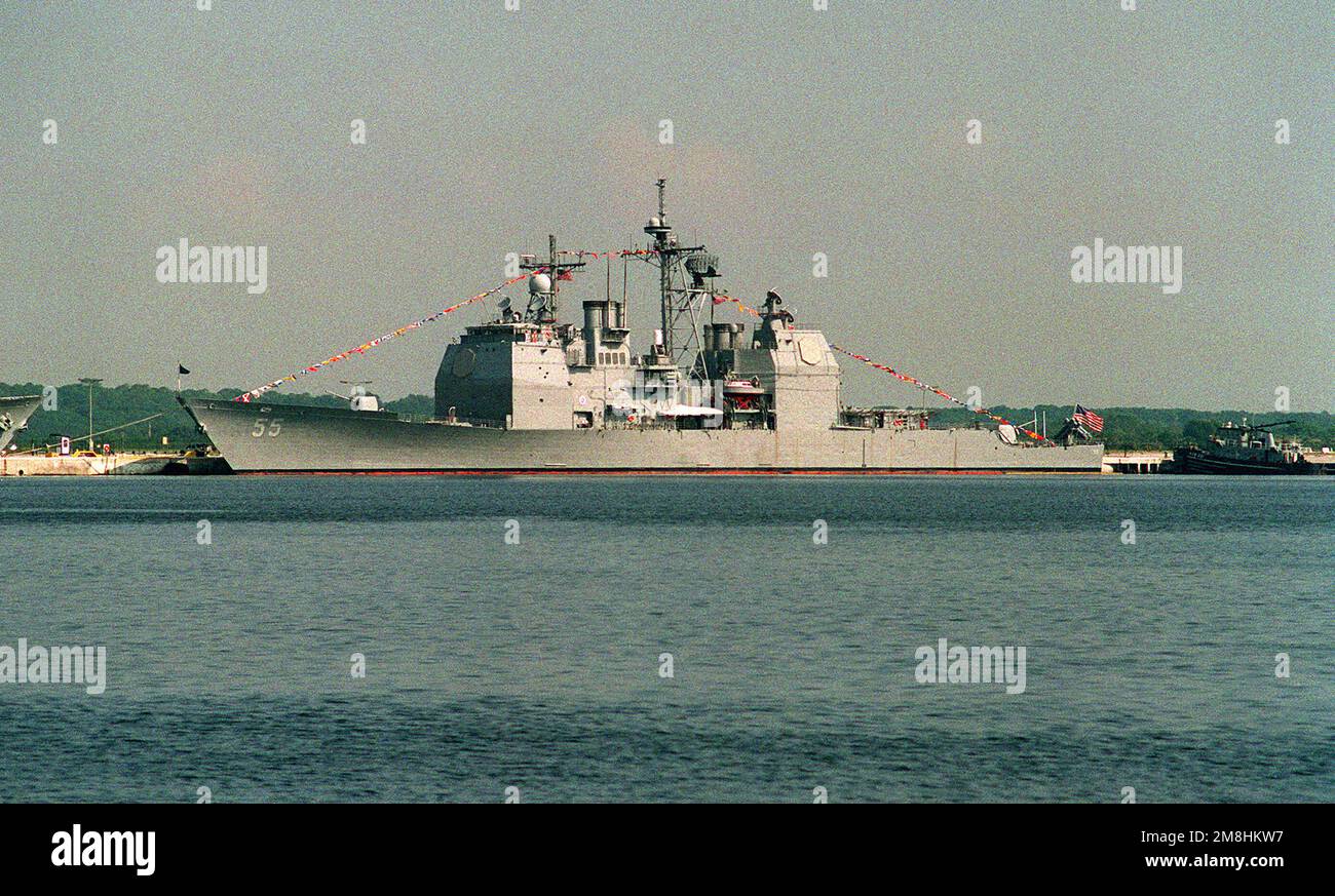 The guided missile cruiser USS LEYTE GULF (CG-55) displays a rainbow of ...