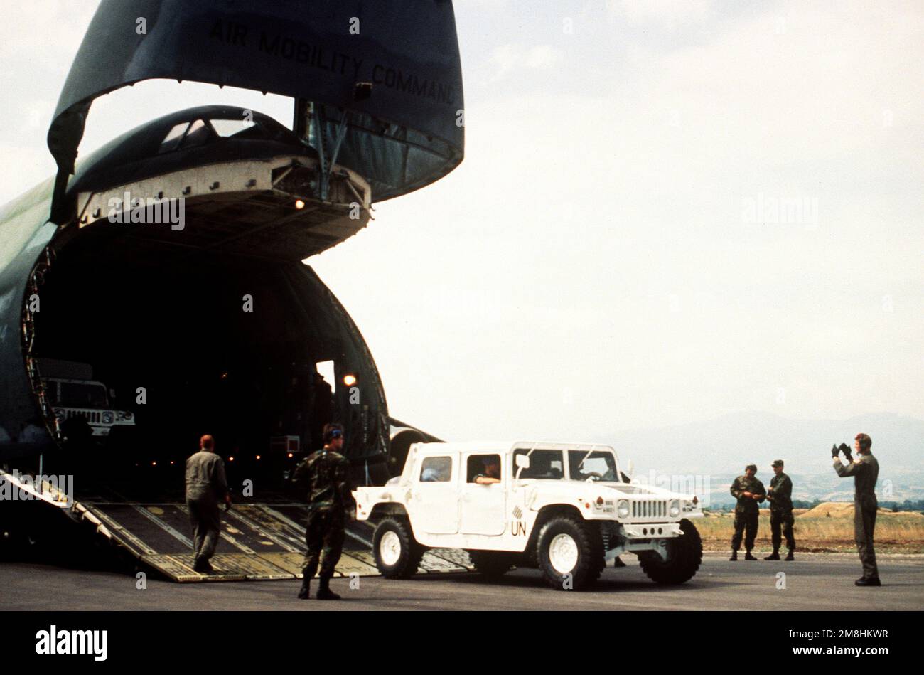 A High-Mobility Multipurpose Wheeled Vehicle (HMMWV) is off-loaded from ...