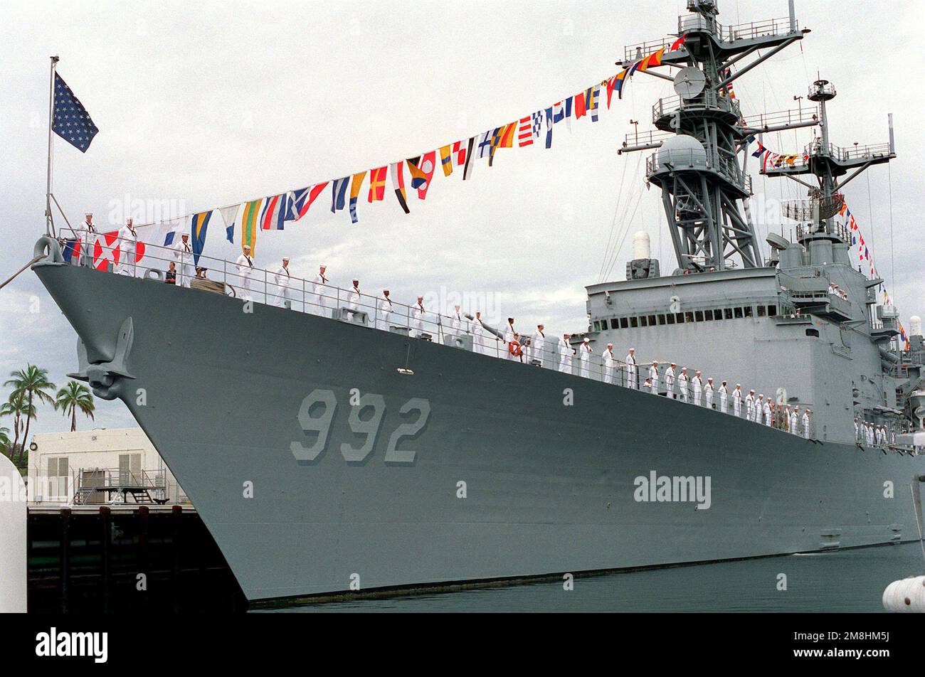 Sailors man the rails aboard the destroyer USS FLETCHER (DD-992) as the admiral's barge ...