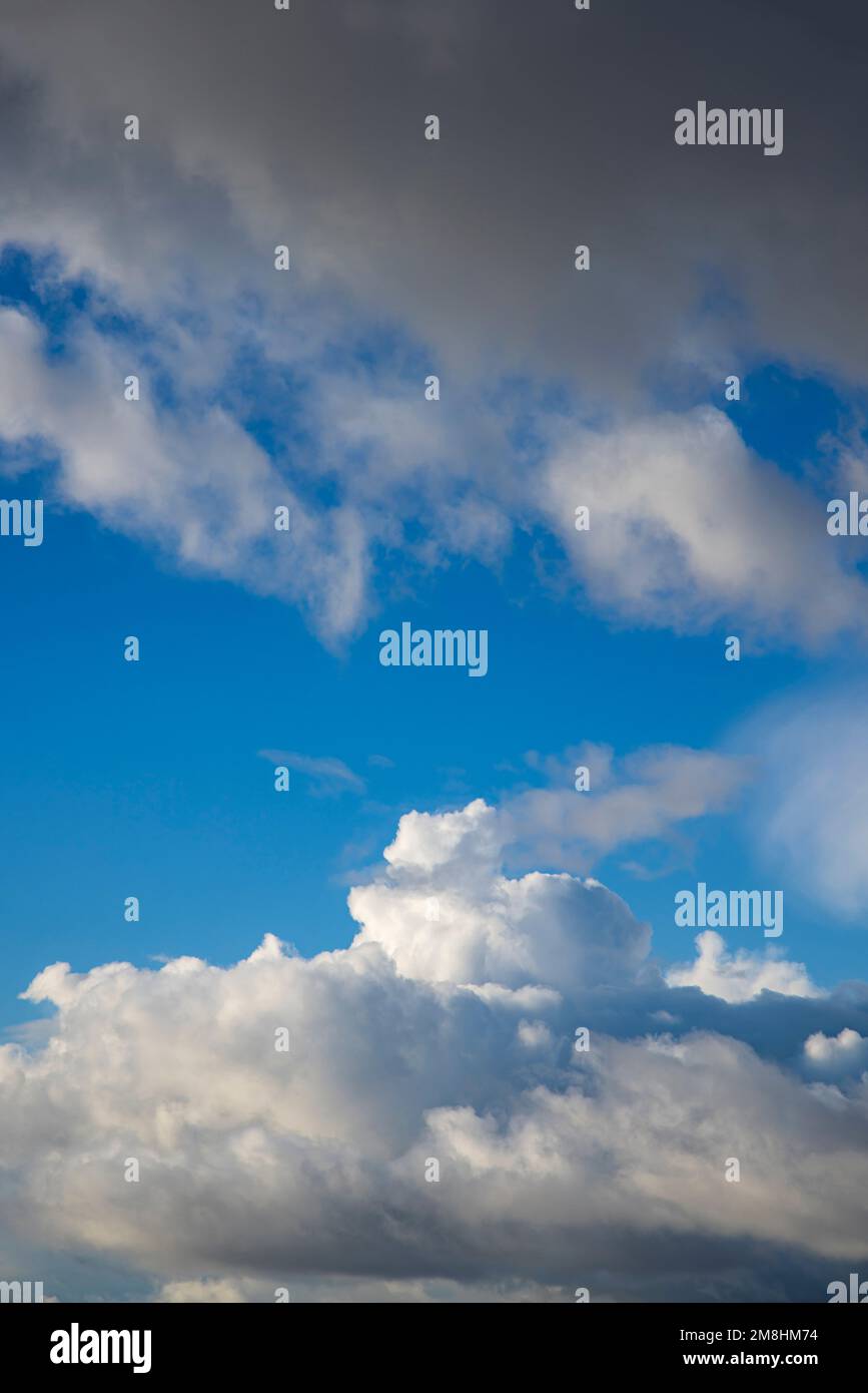 Cumulus clouds against a blue sky Stock Photo - Alamy