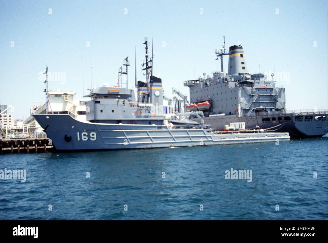 A port bow view of the fleet tug USNS NAVAJO (T-ATF-169) tied up to the ...