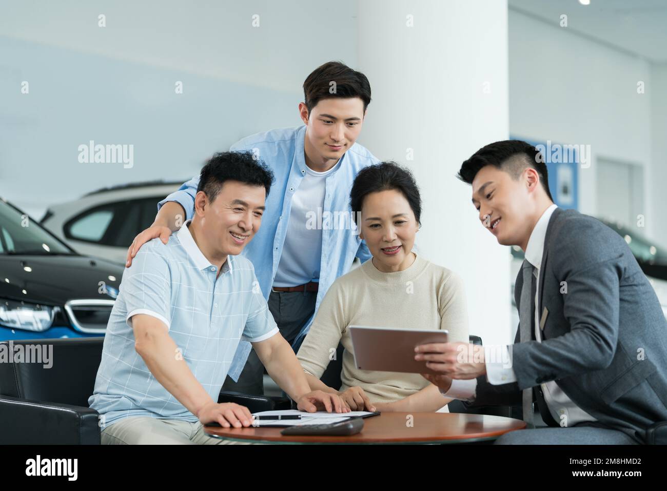 Three of choose and buy cars Stock Photo - Alamy