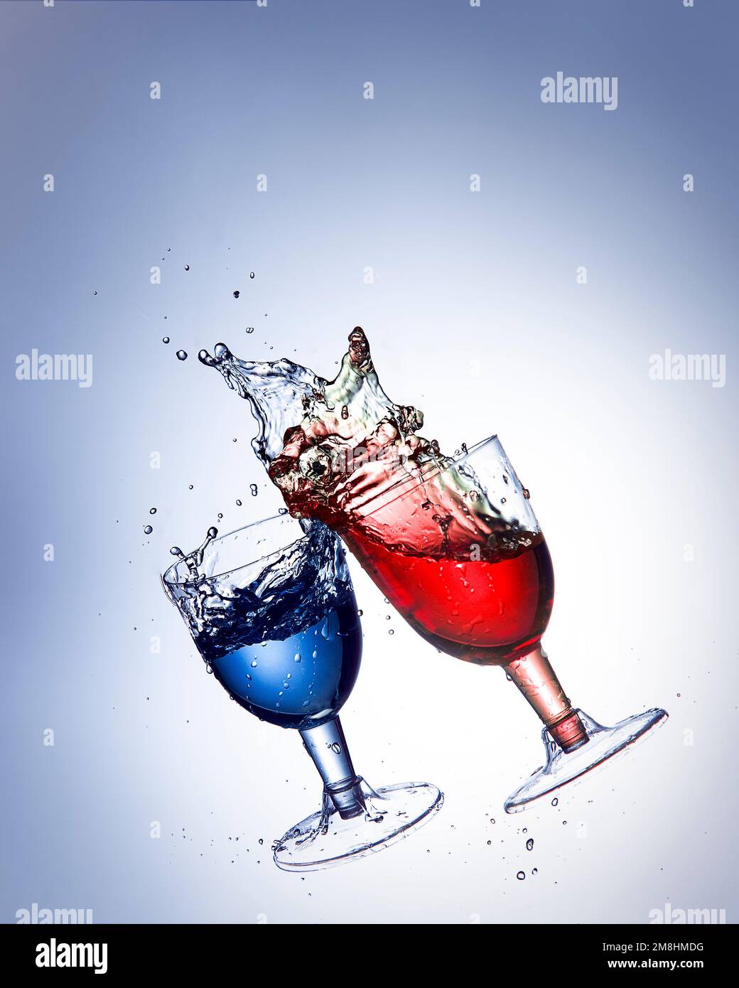 Liquids: splashing two glasses together Stock Photo - Alamy