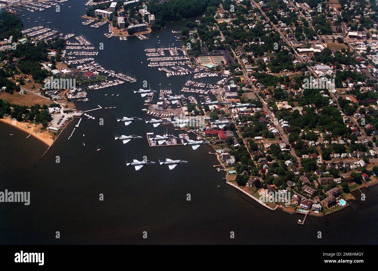 Thirteen A-4J Skyhawk aircraft of Fighter Squadron 43 (VF-43) fly over ...