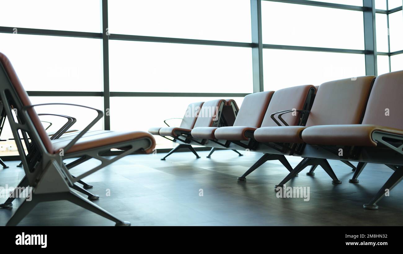Modern airport waiting area with leather seats Stock Photo - Alamy