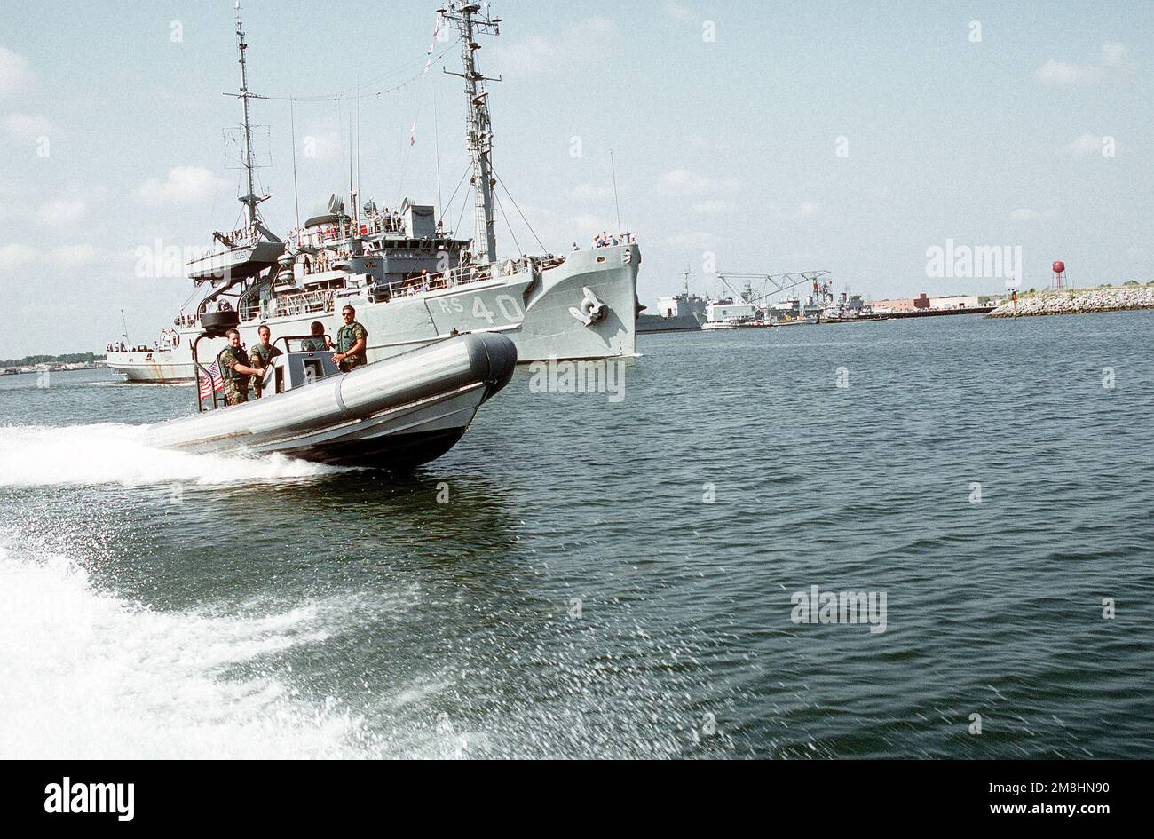 A rigid-hulled inflatable boat (RIB) of Special Boat Unit 20 underway ...
