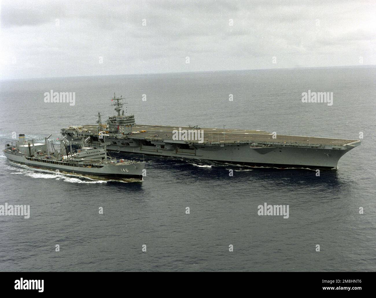 A starboard bow view of the nuclear-powered aircraft carrier USS NIMITZ ...