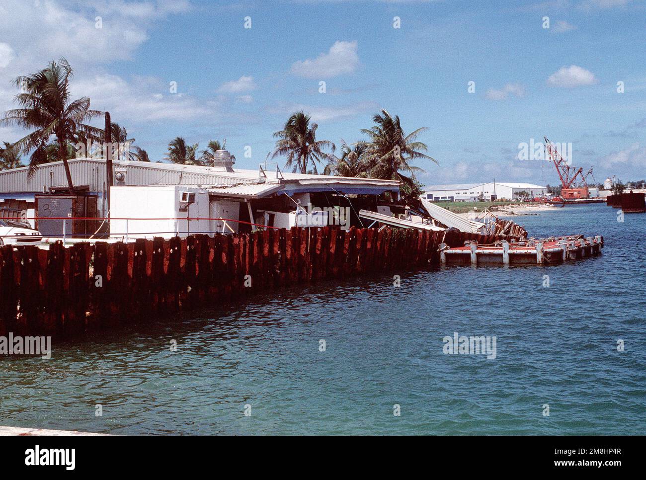 Trader Andy's Hut, a pierside bar and grill, displays damage sustained ...