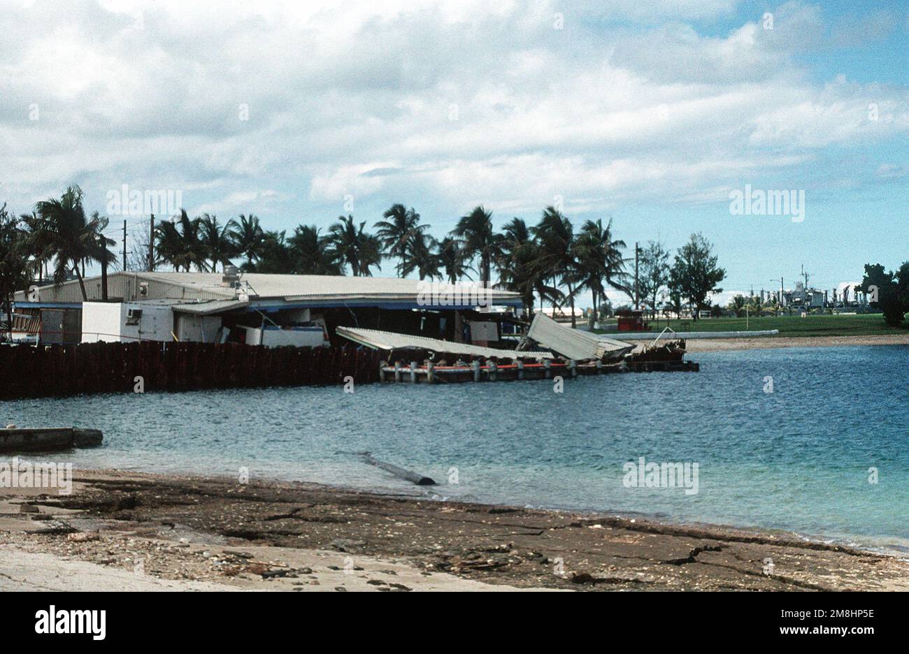 Trader Andy's Hut, a pierside bar and grill, displays damage sustained ...