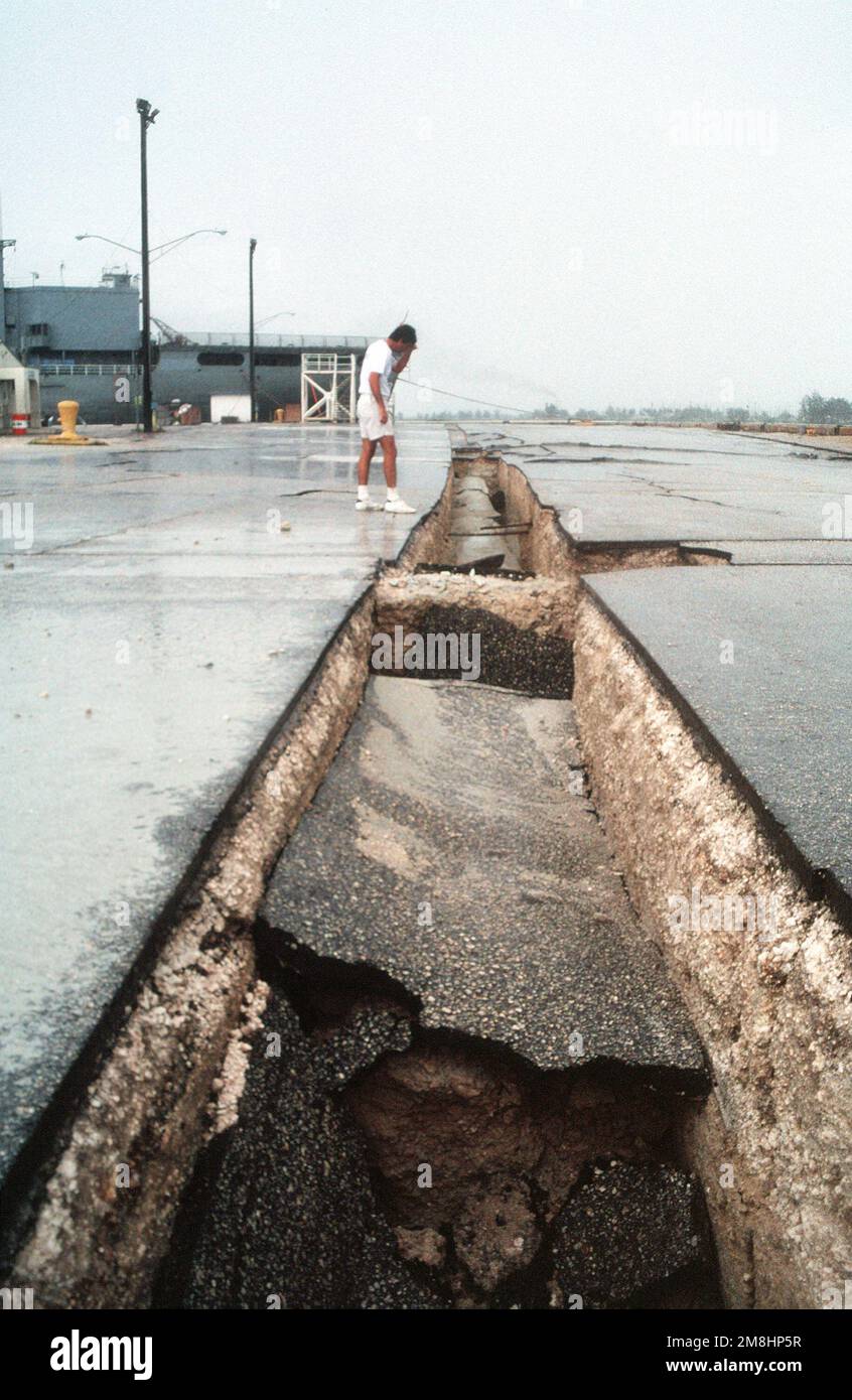 Peter Wagner, a local journalist, looks at a large split in the ...