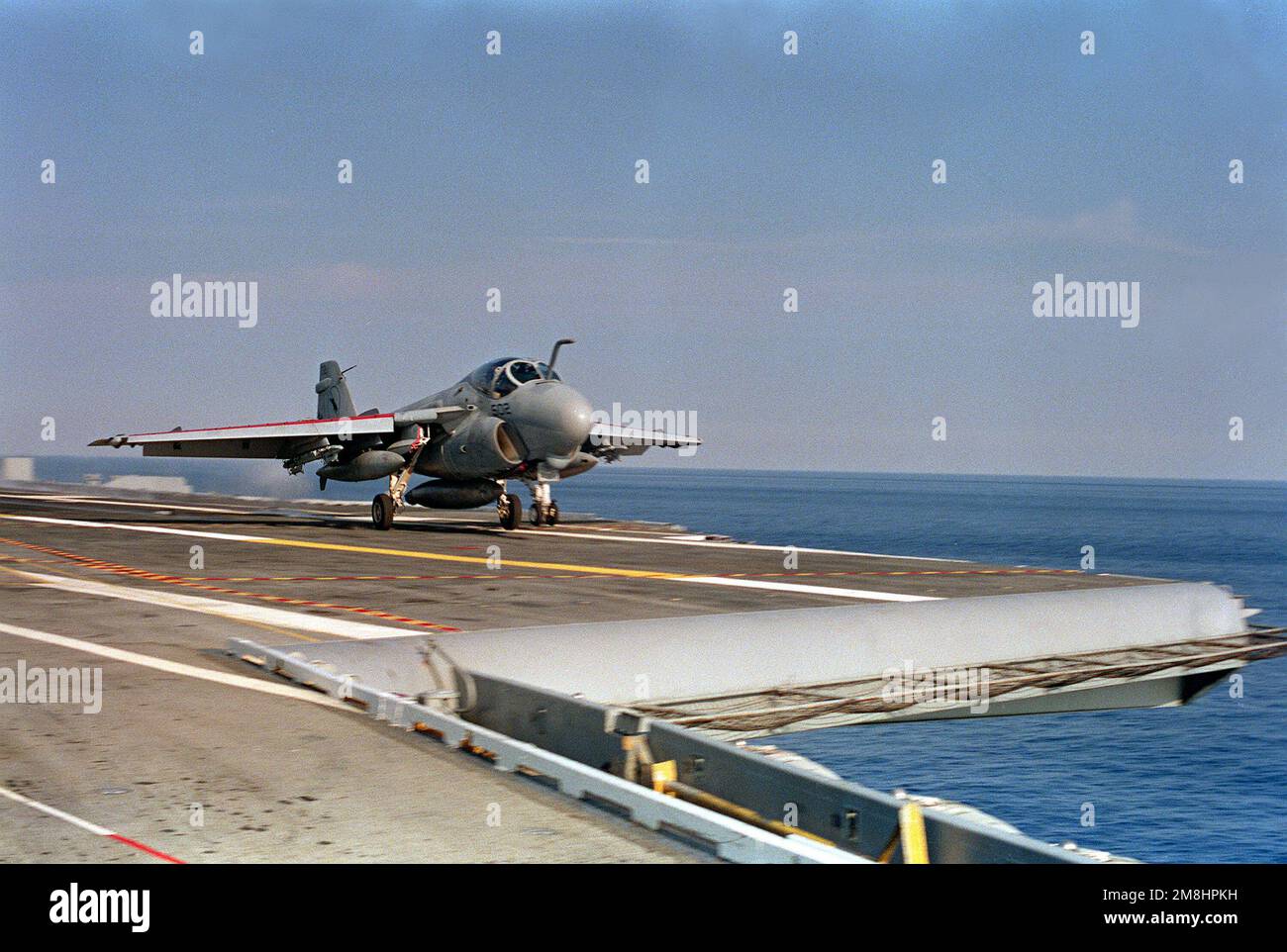 An A-6E Intruder aircraft of Attack Squadron 35 (VA-35) is launched during flight operations ...