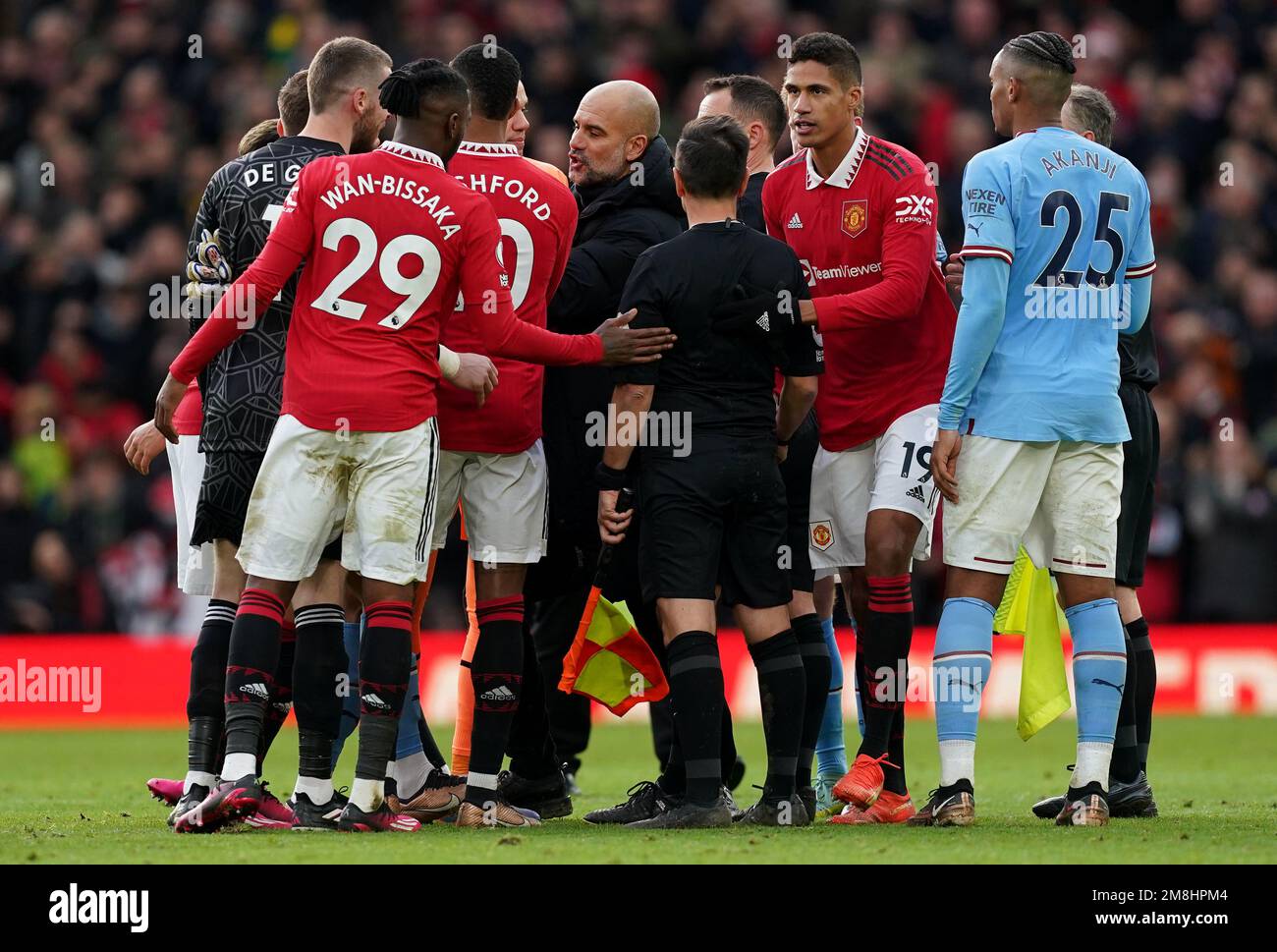 Manchester City manager Pep Guardiola is surrounded by Manchester ...