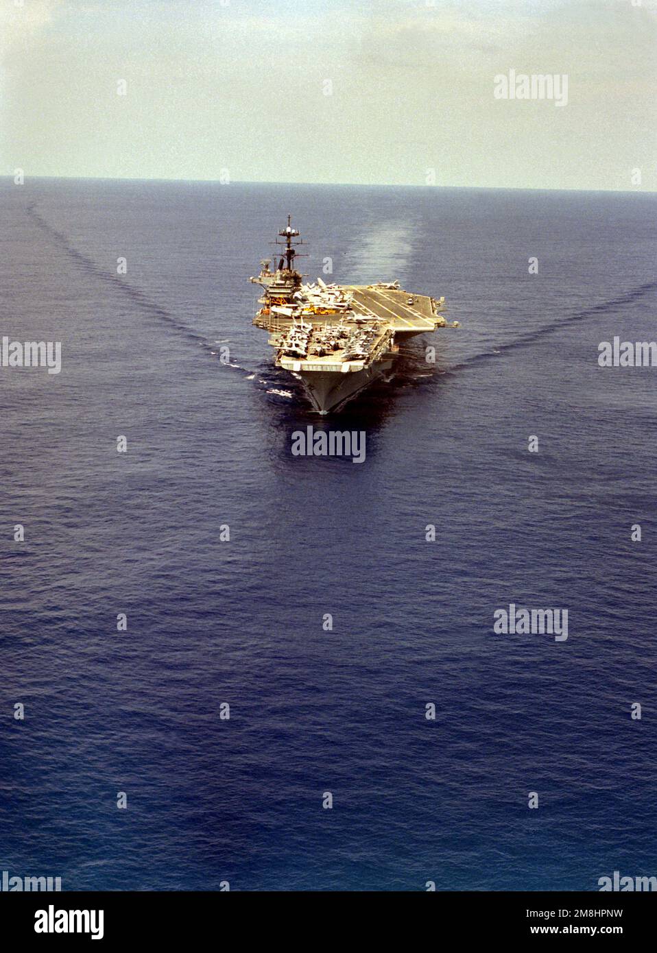 A bow view of the aircraft carrier USS SARATOGA (CV-60) underway. Base ...