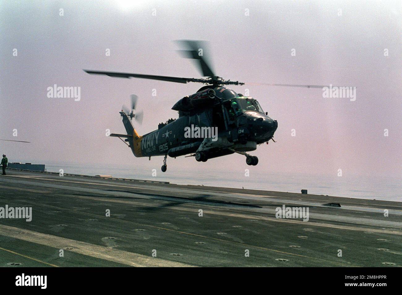 The last operational SH-2F Sea Sprite helicopter lands aboard the ...