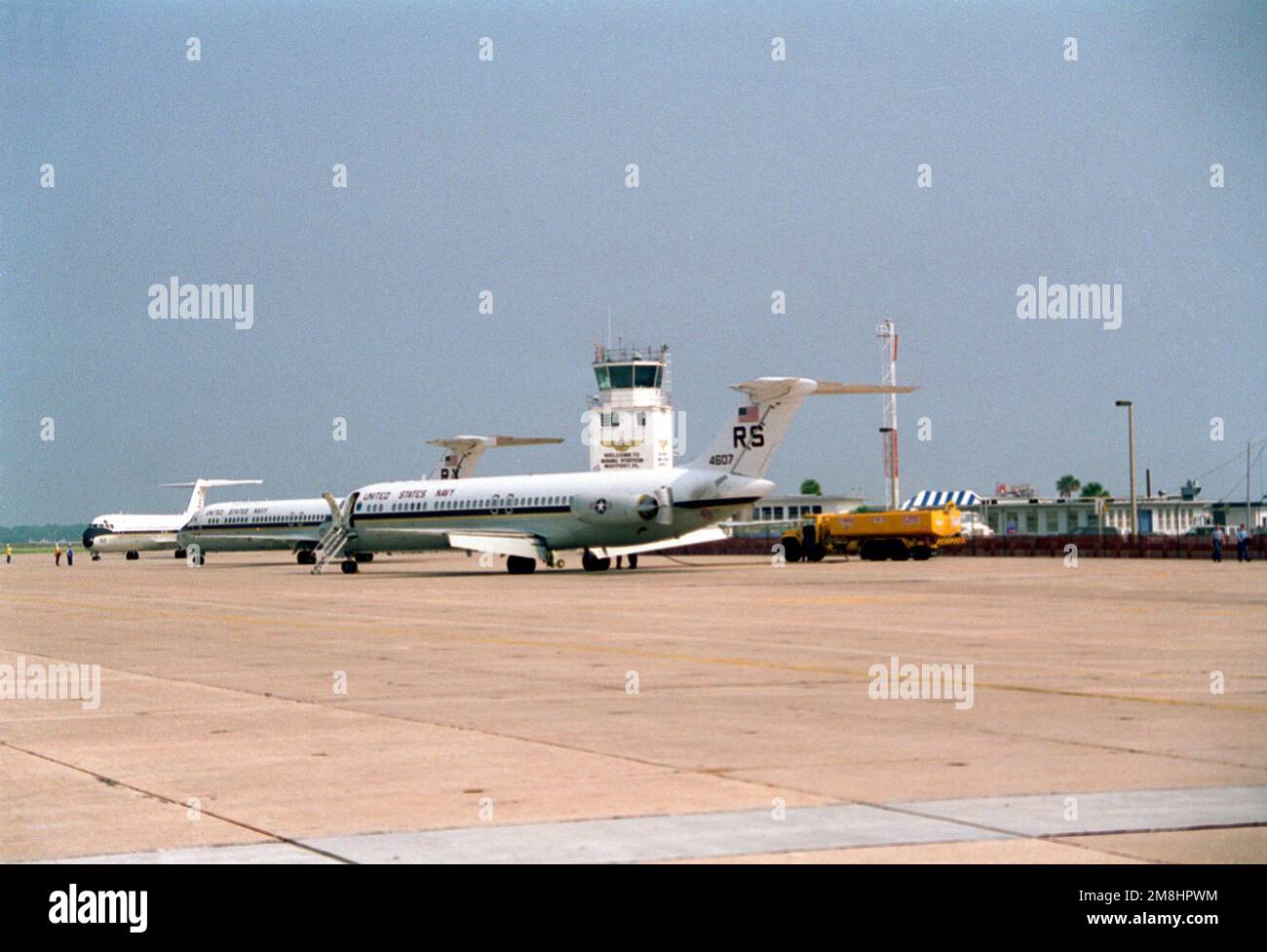 Three C-9B Skytrain II aircraft are serviced on the flight line at ...