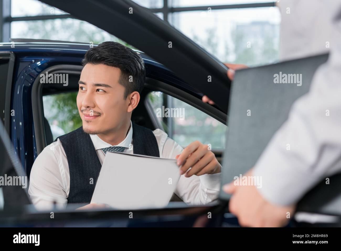 The young man test drive car Stock Photo - Alamy