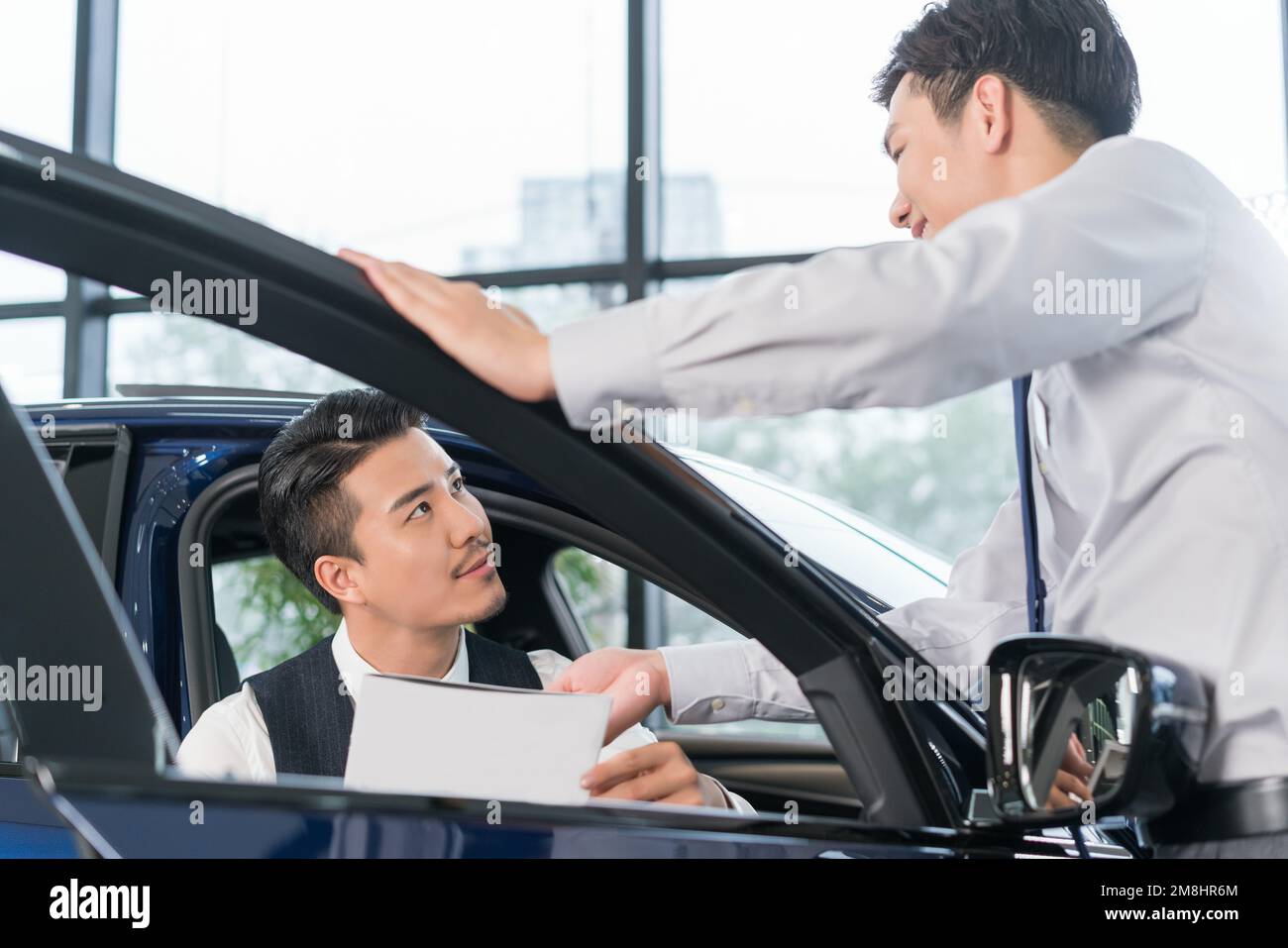 The young man test drive car Stock Photo - Alamy