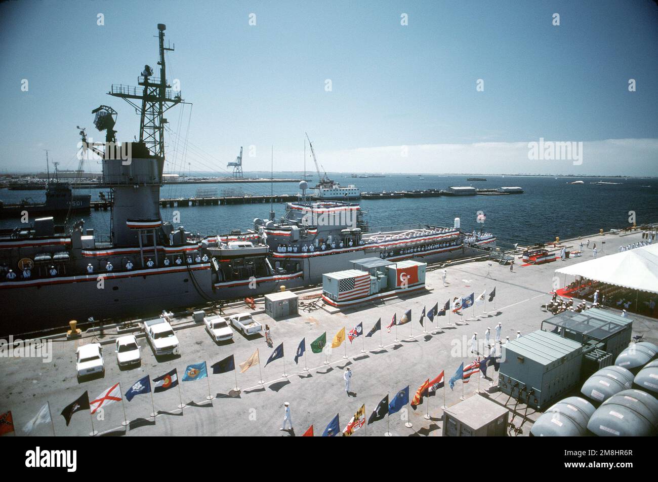 Bunting decorates the frigate USS REASONER (FF 1063) as sailors man the ...