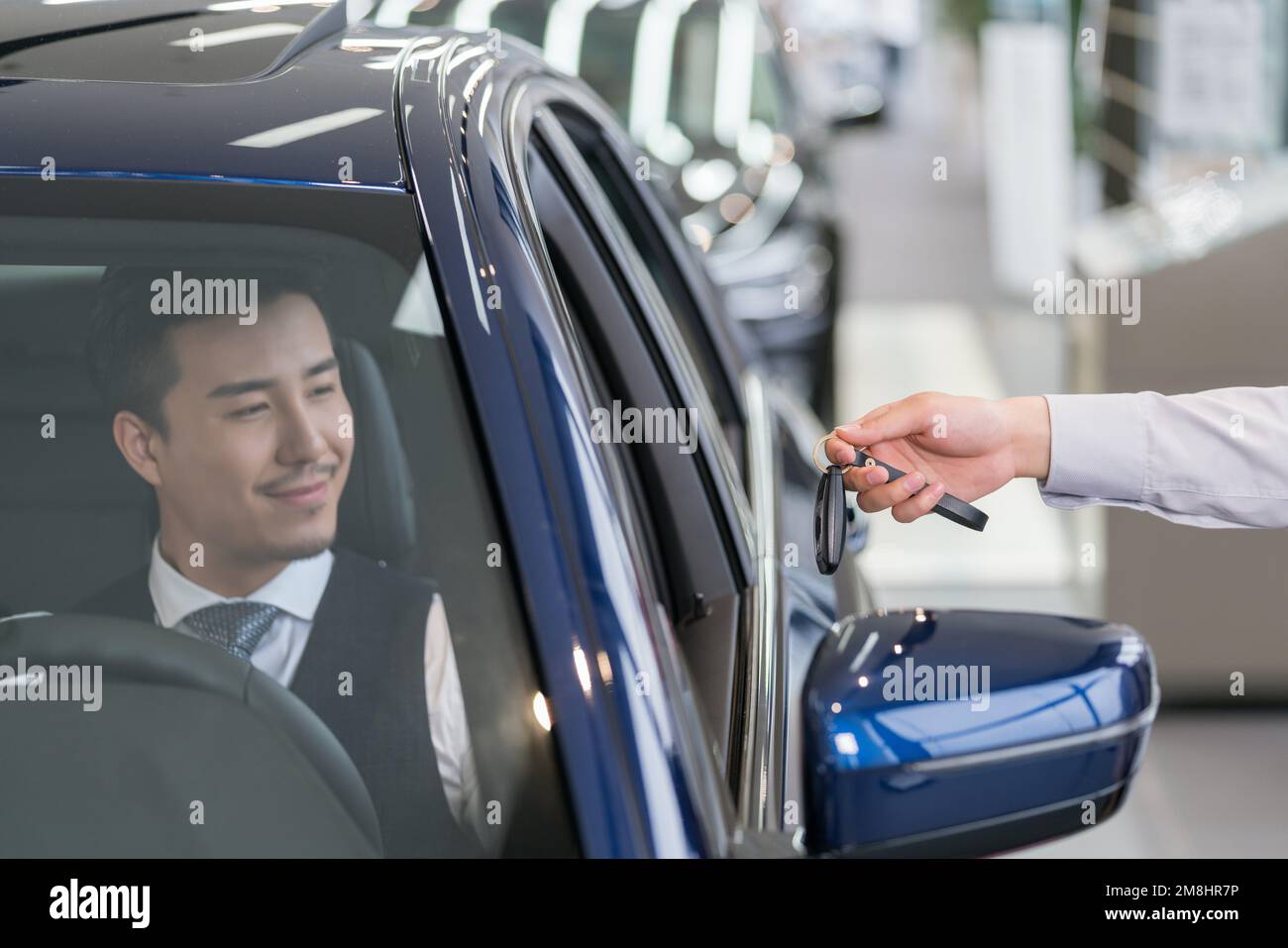 The young man test drive car Stock Photo - Alamy