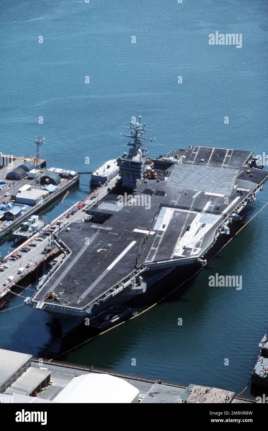 An aerial port bow view of the nuclear-powered aircraft carrier USS ...