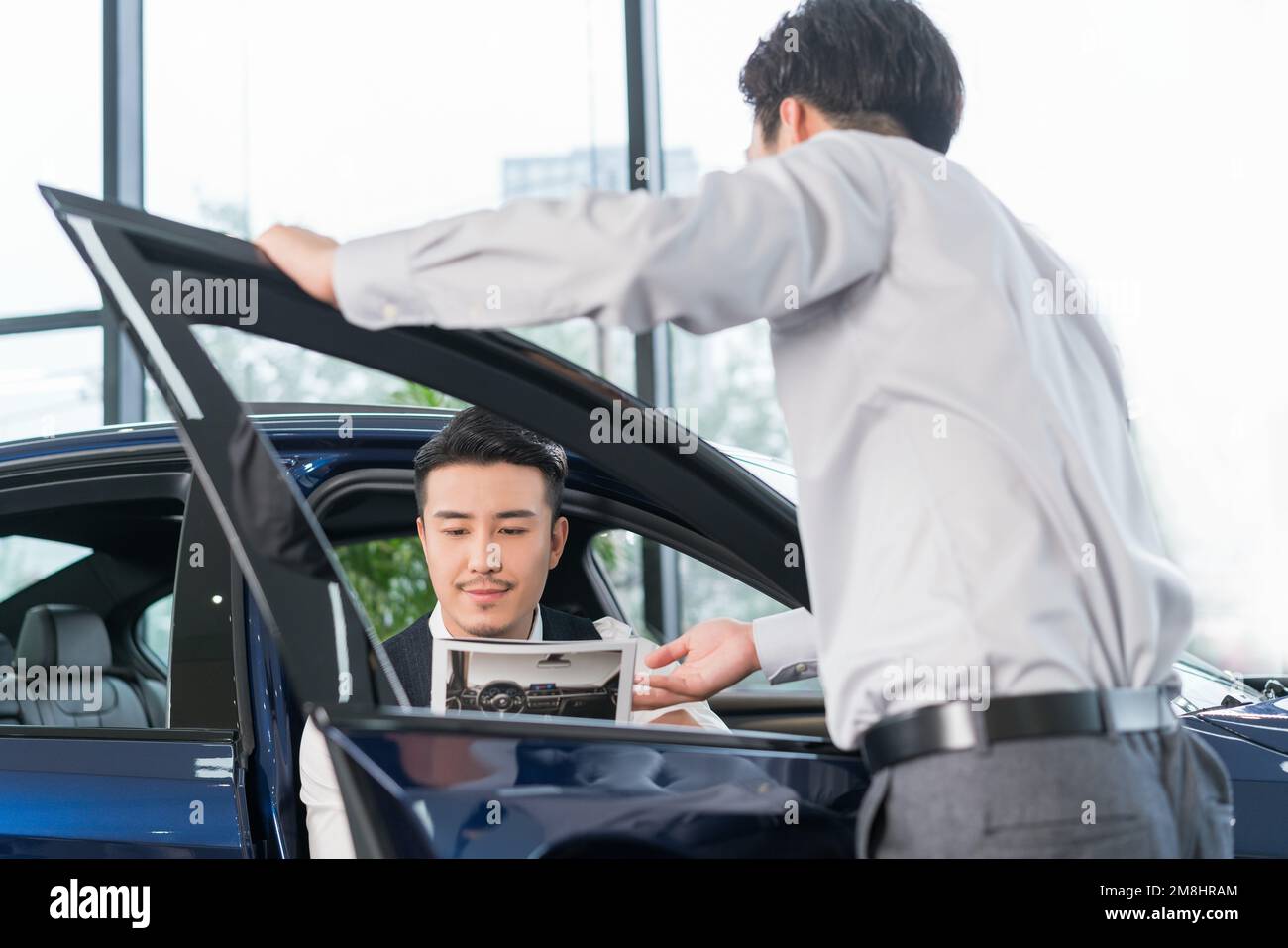 The young man test drive car Stock Photo - Alamy