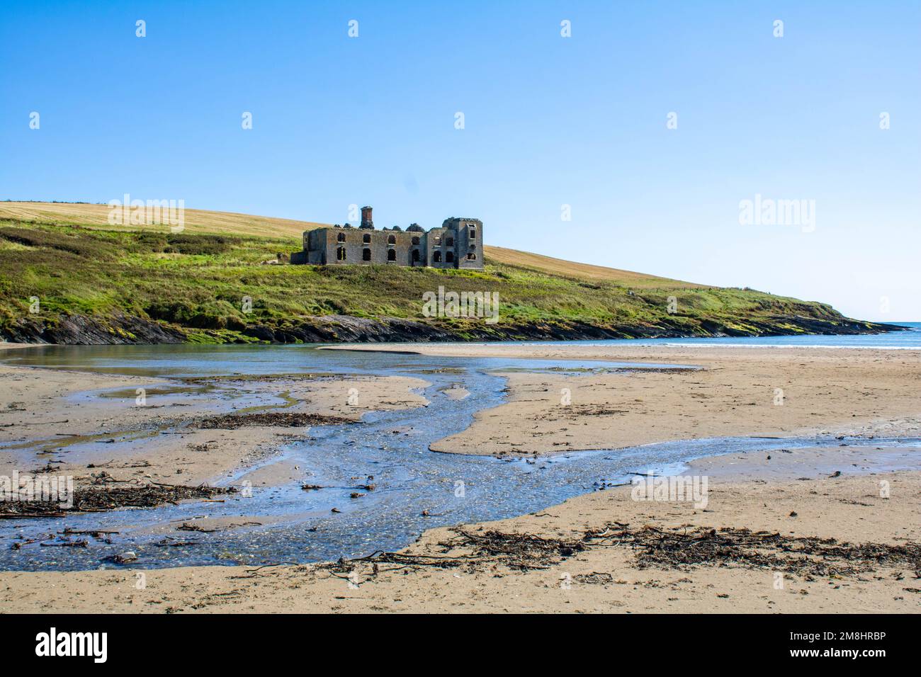The ruins of Howe Strand Coast Guard Station before a sandy coast on a ...