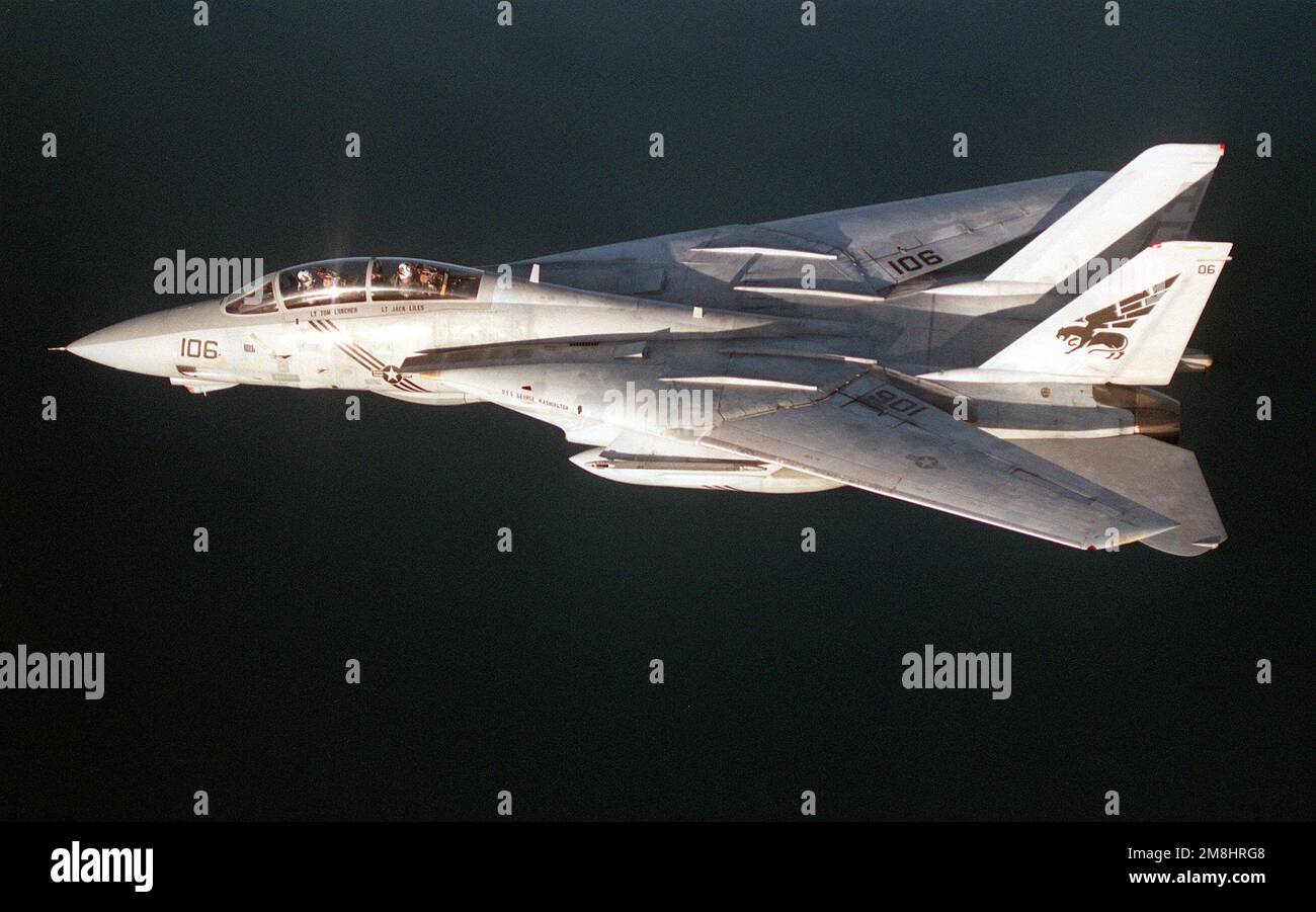 Air to air left side view of an F-14B Tomcat aircraft of Fighter Squadron 143 (VF-143), the ...