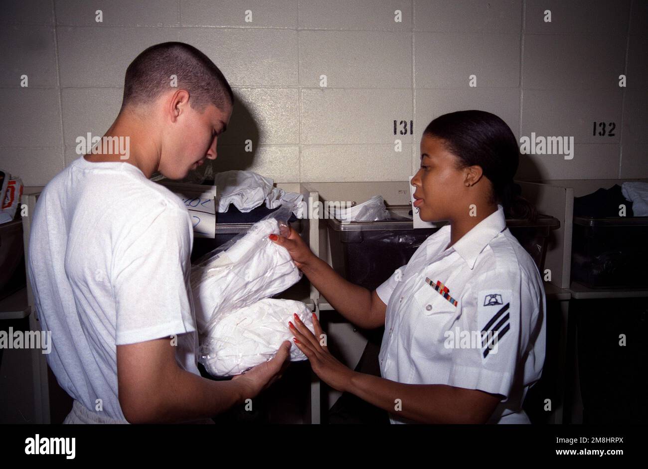 Mess Management SPECIALIST SEAMAN (MSSN) Leslie Donaldson helps a new ...