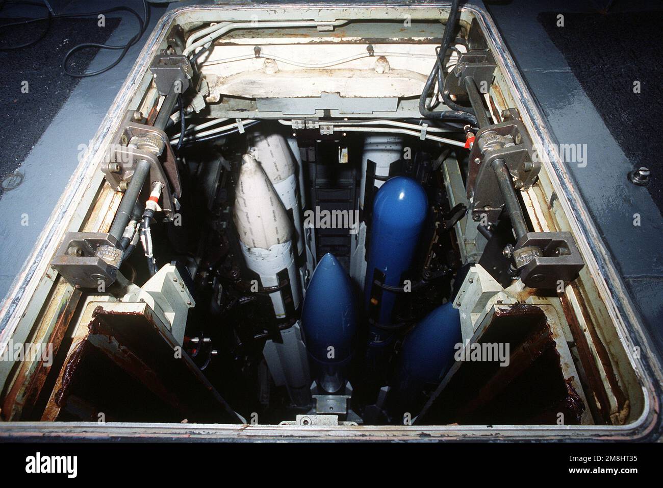 A view through the loading arm door of various missiles in the magazine ...