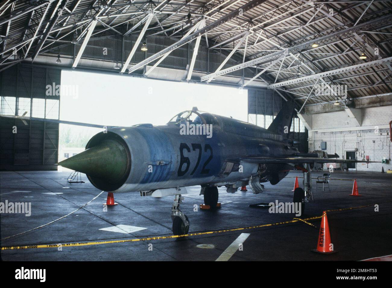 A left side view of a Cuban MiG-21 fighter aircraft inside VF-45 hangar. It was flown to Key ...