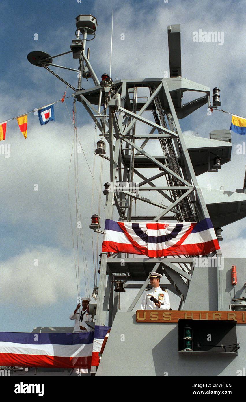 As the officer of the watch stands by on the bridge wing of the Cyclone ...