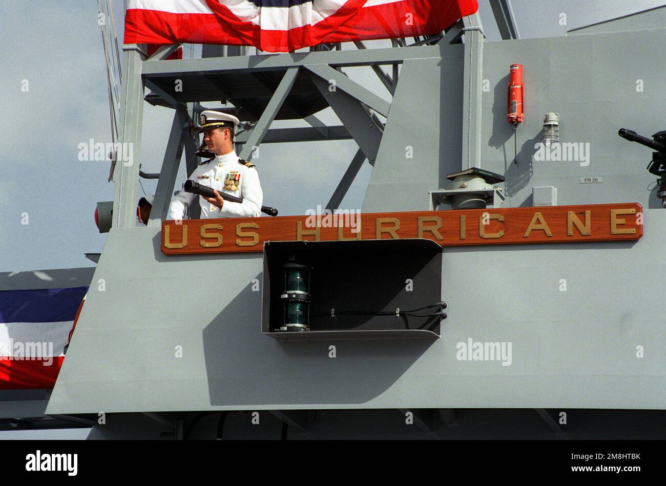 The officer of the watch sets the first watch aboard the newly ...