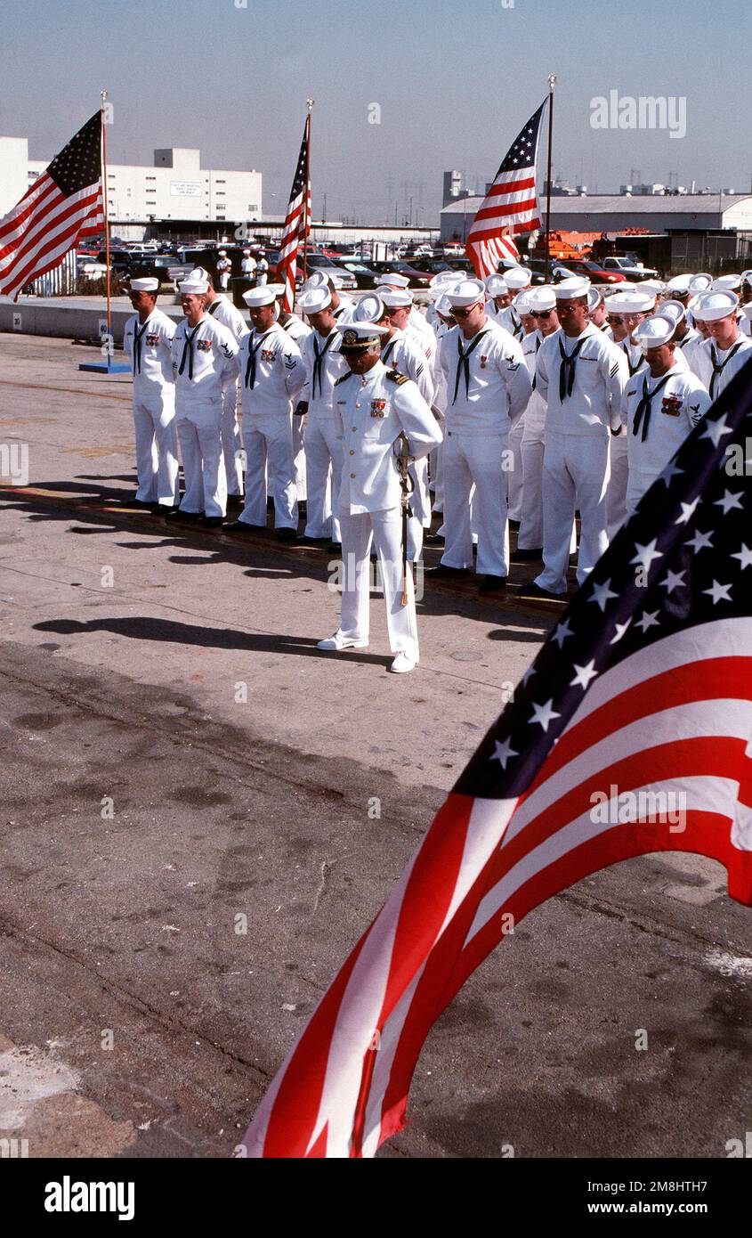 Crew members stand in formation during the decommissioning ceremony of ...