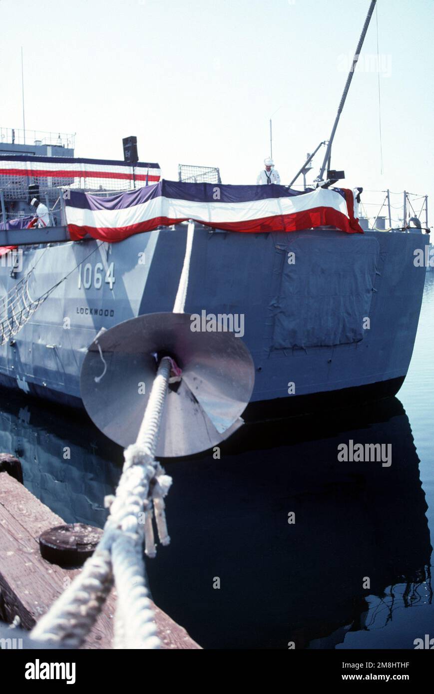 Crew members prepare to remove bunting from the rails of the former ...