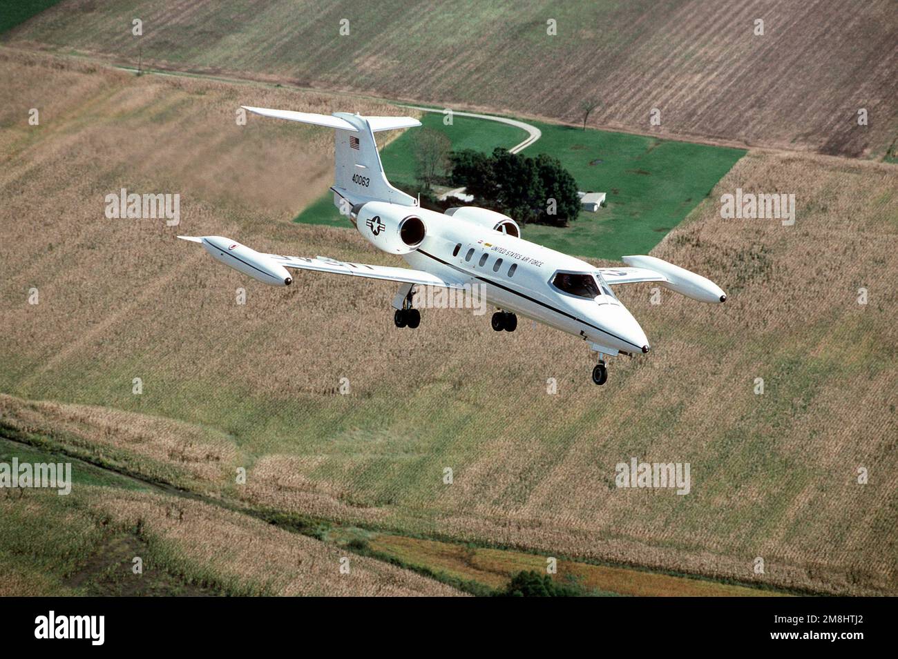 An air-to-air, three quarter, high front view of a Lear Jet built C-21A ...