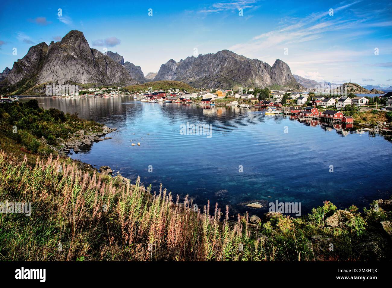 The village of Reine sits on a protected harbor on the coast of ...