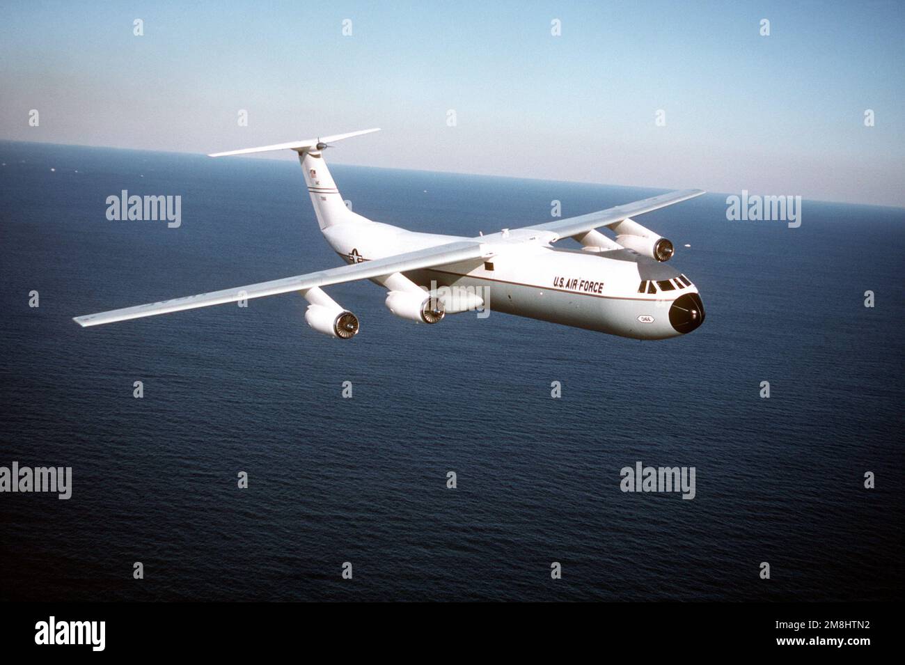 An air-to-air side view of a 438th Airlift Wing, C-141 Starlifter ...